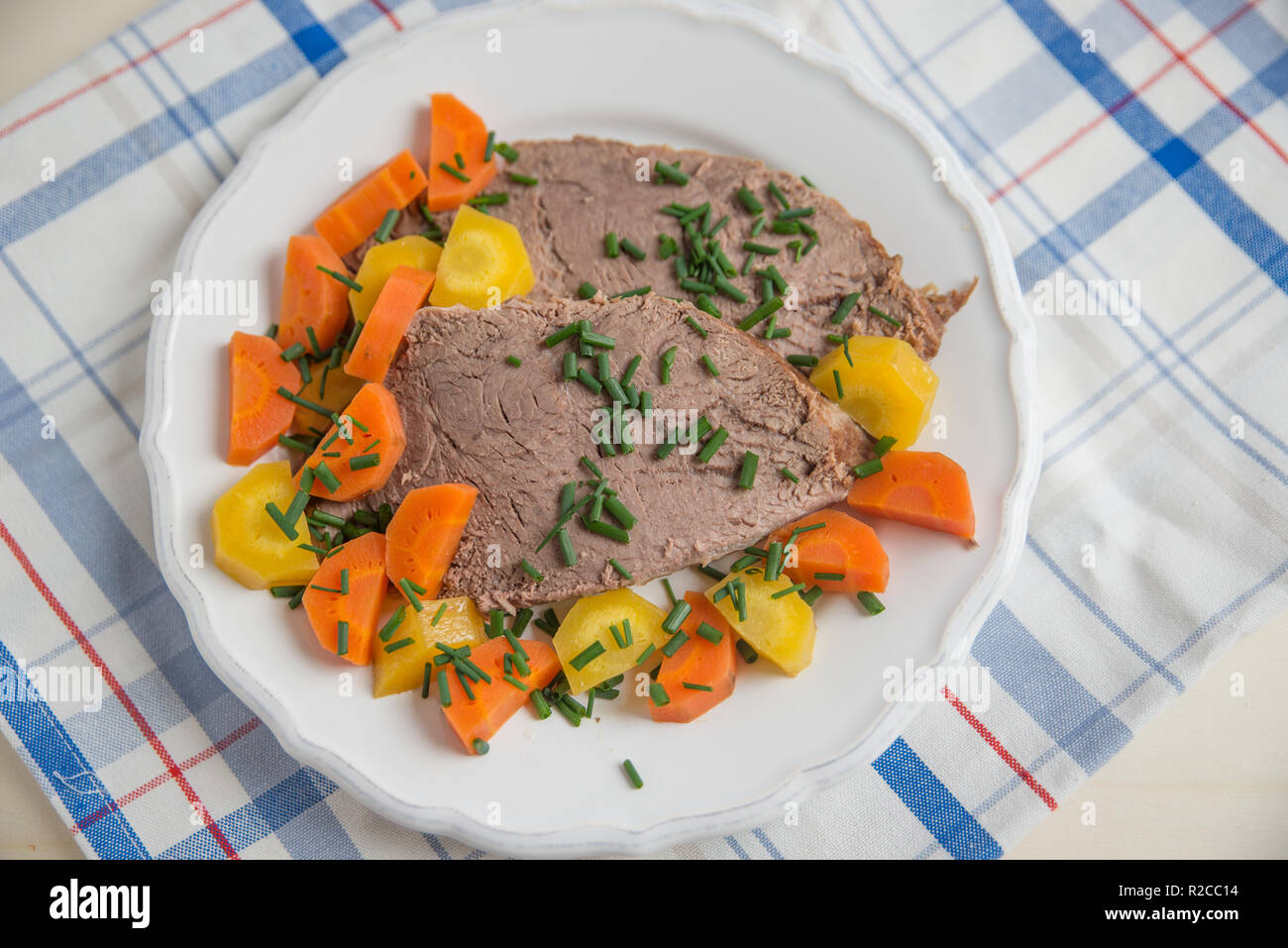 Prime boiled beef with root vegetables, Viennese Tafelspitz Stock Photo ...