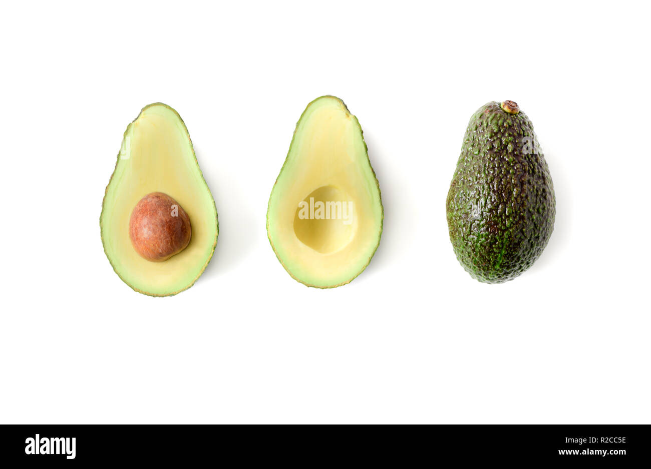 Fresh avocado. Whole avocado fruit and two halves in a row isolated on ...
