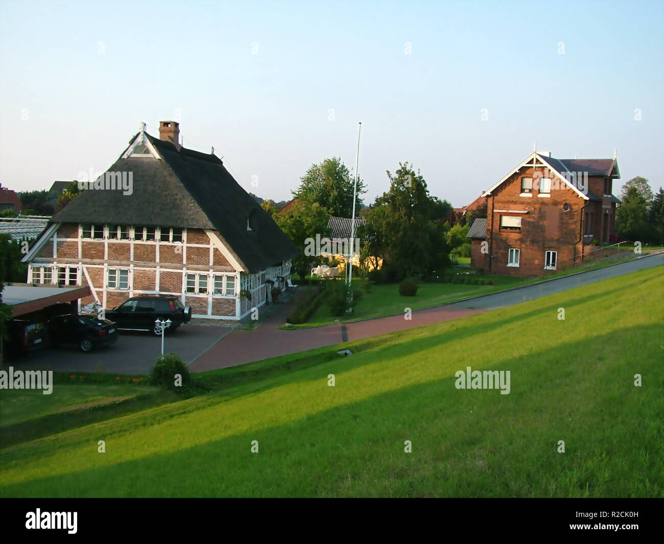 Houses behind the dike hi-res stock photography and images - Alamy