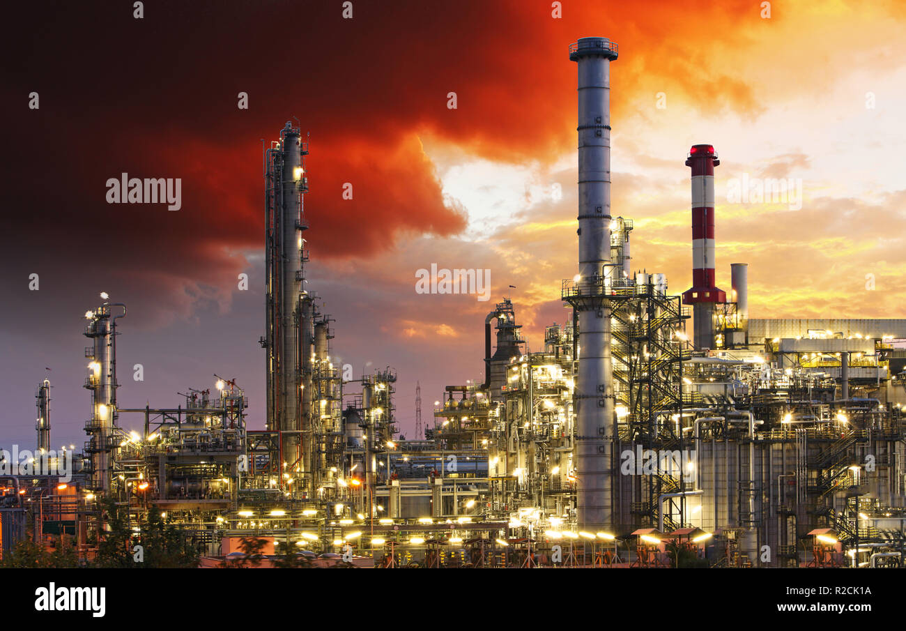 Oil indutry refinery - factory with dramatic sunset Stock Photo - Alamy
