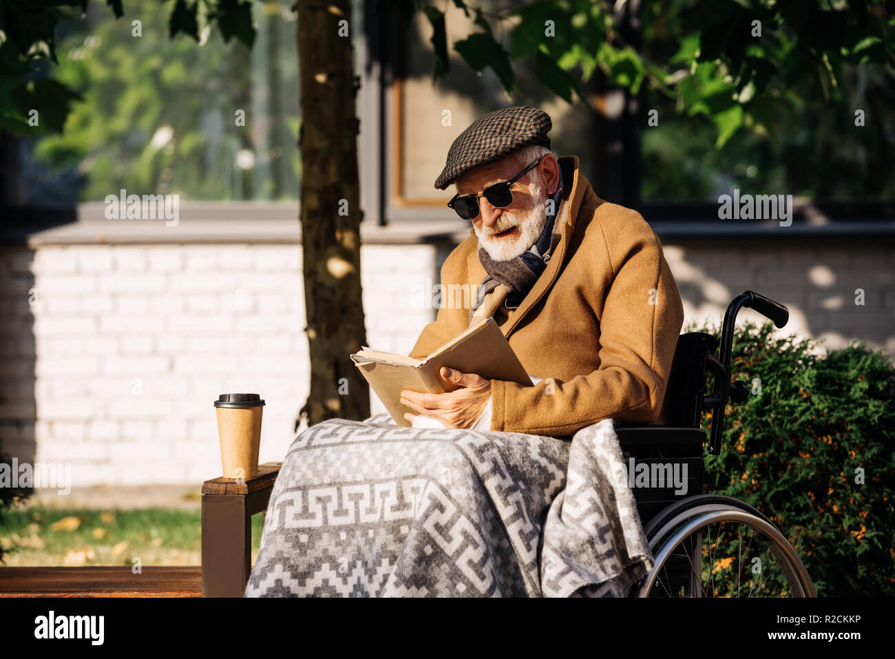 Senior man disability reading book hi-res stock photography and images ...