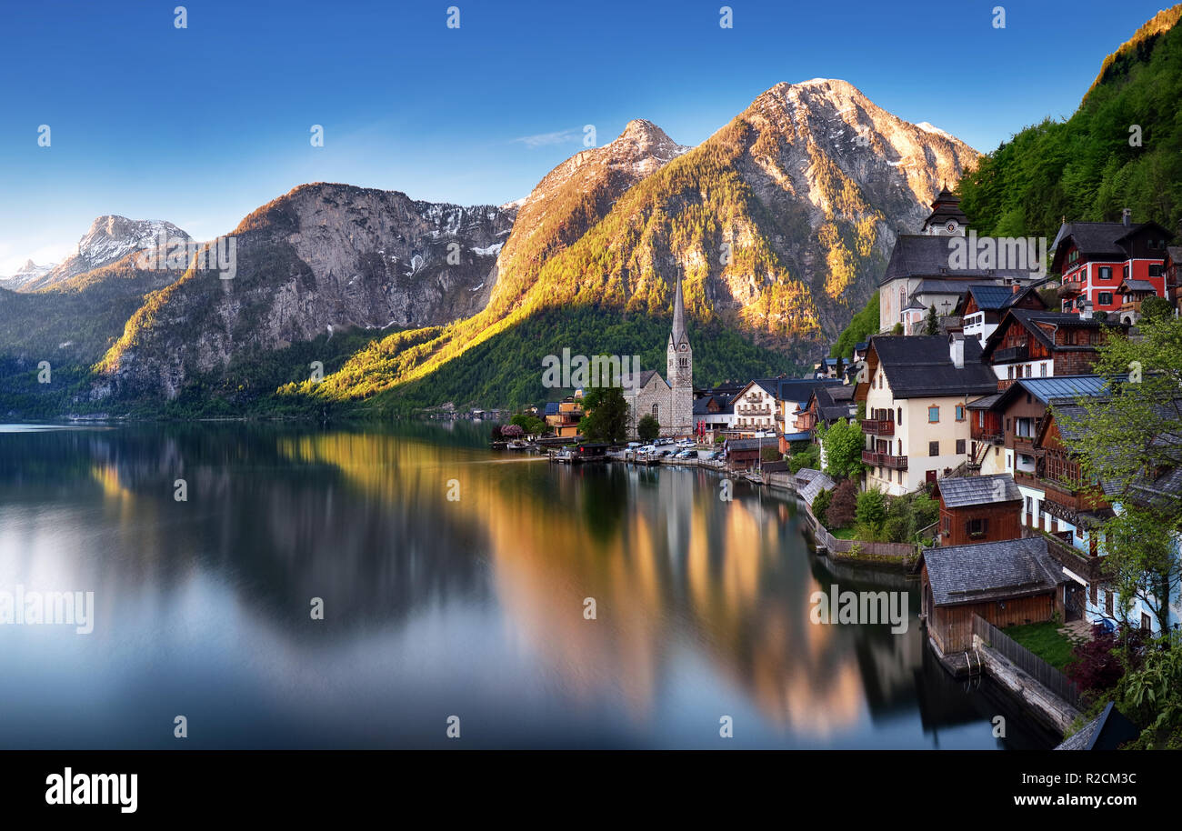 Classic postcard view of famous Hallstatt lakeside town reflecting in ...