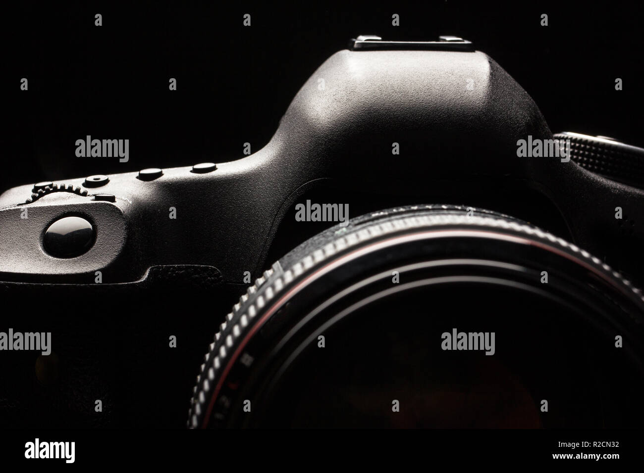 Professional modern DSLR camera low key image - Modern DSLR camera with ...