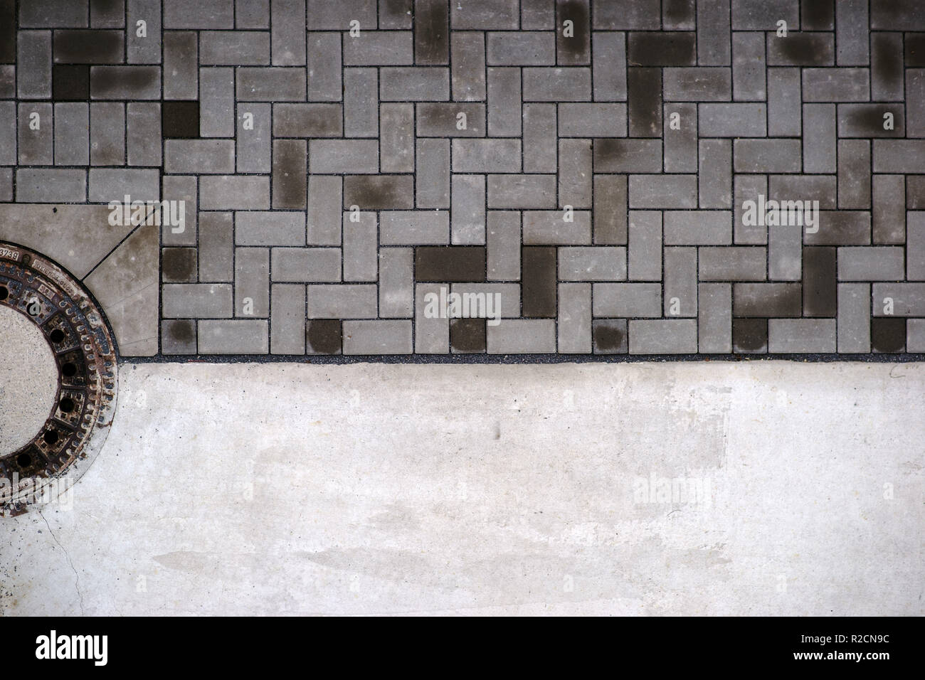 The aerial view and top view of a walkway with paving stones and a ...