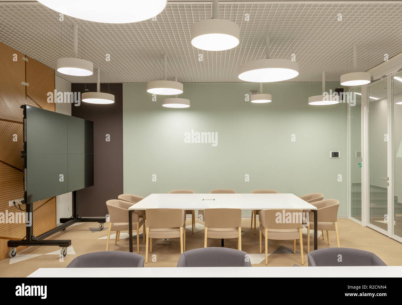 Modern office meeting room interior with blank presentation screen ...