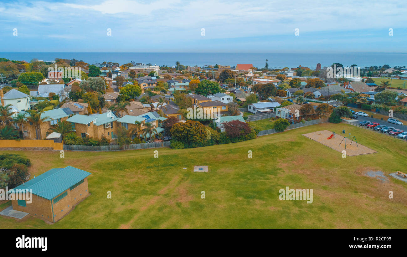 Suburban area and grassy park on ocean shore - aerial view Stock Photo ...