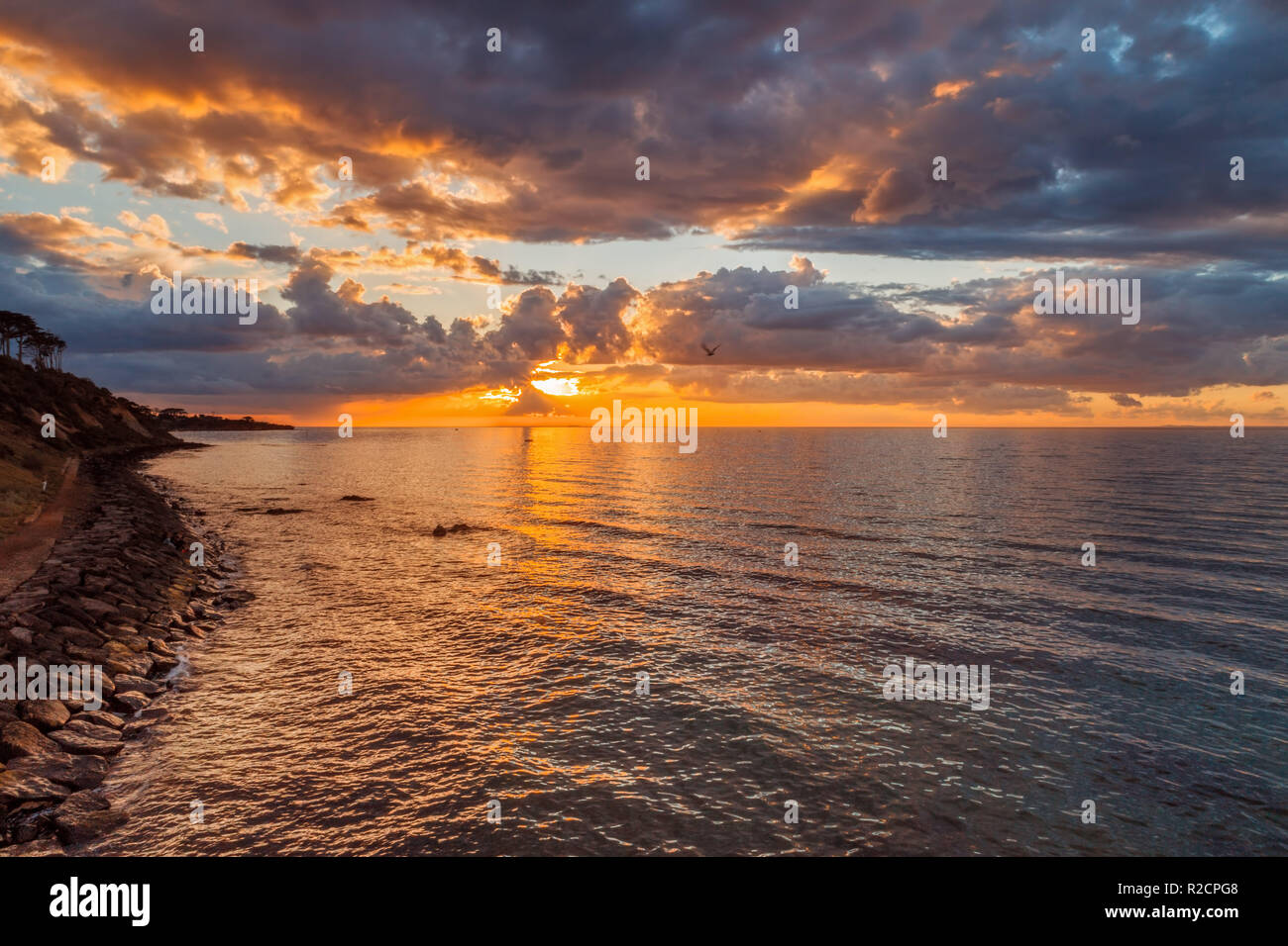 Sunrise sunset over water in hi-res stock photography and images - Alamy