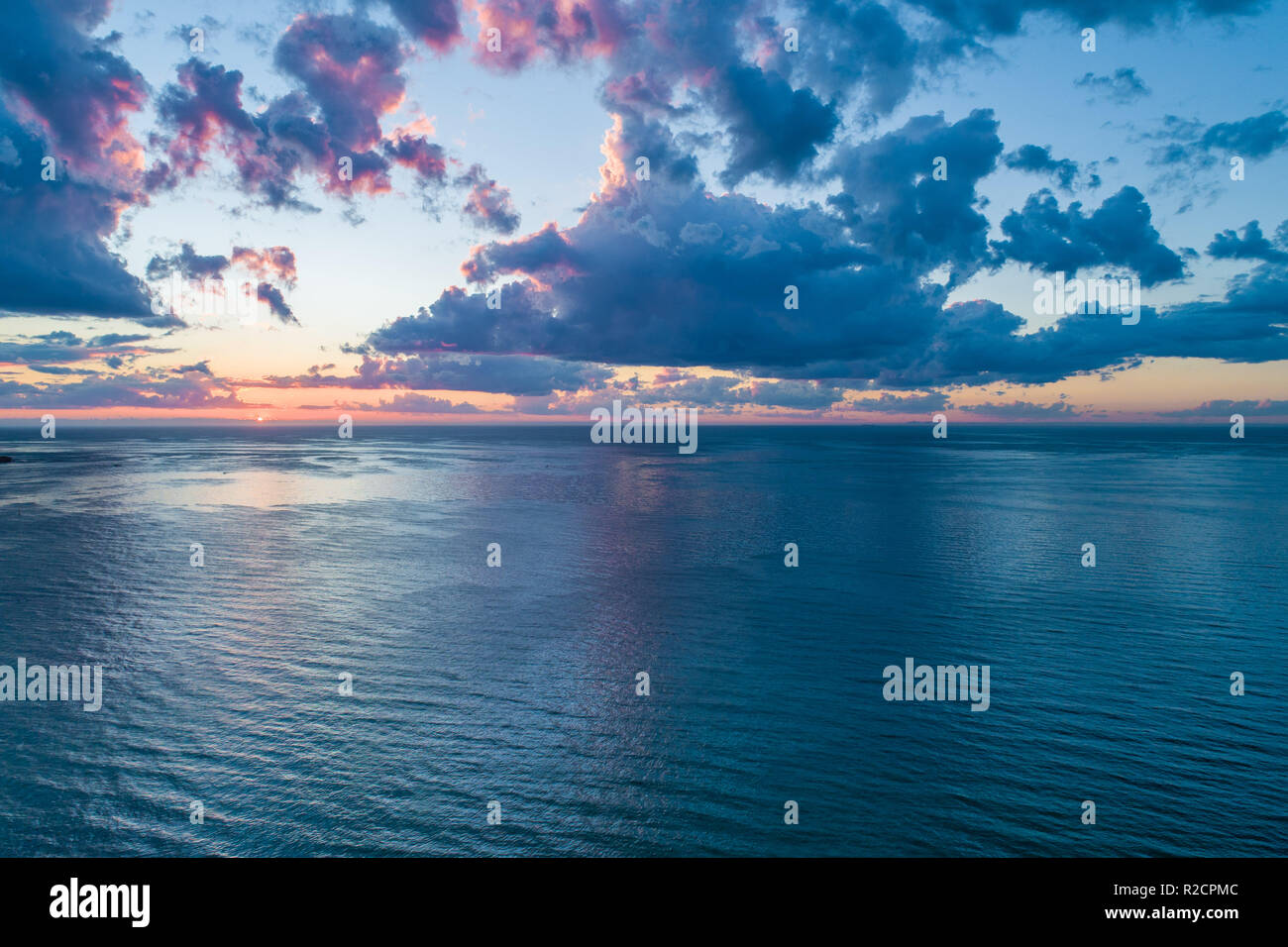 Aerial view of sunset over ocean Stock Photo - Alamy