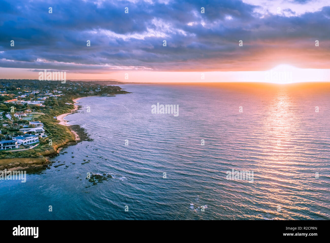 Sunset over ocean near coastline aerial view Stock Photo - Alamy