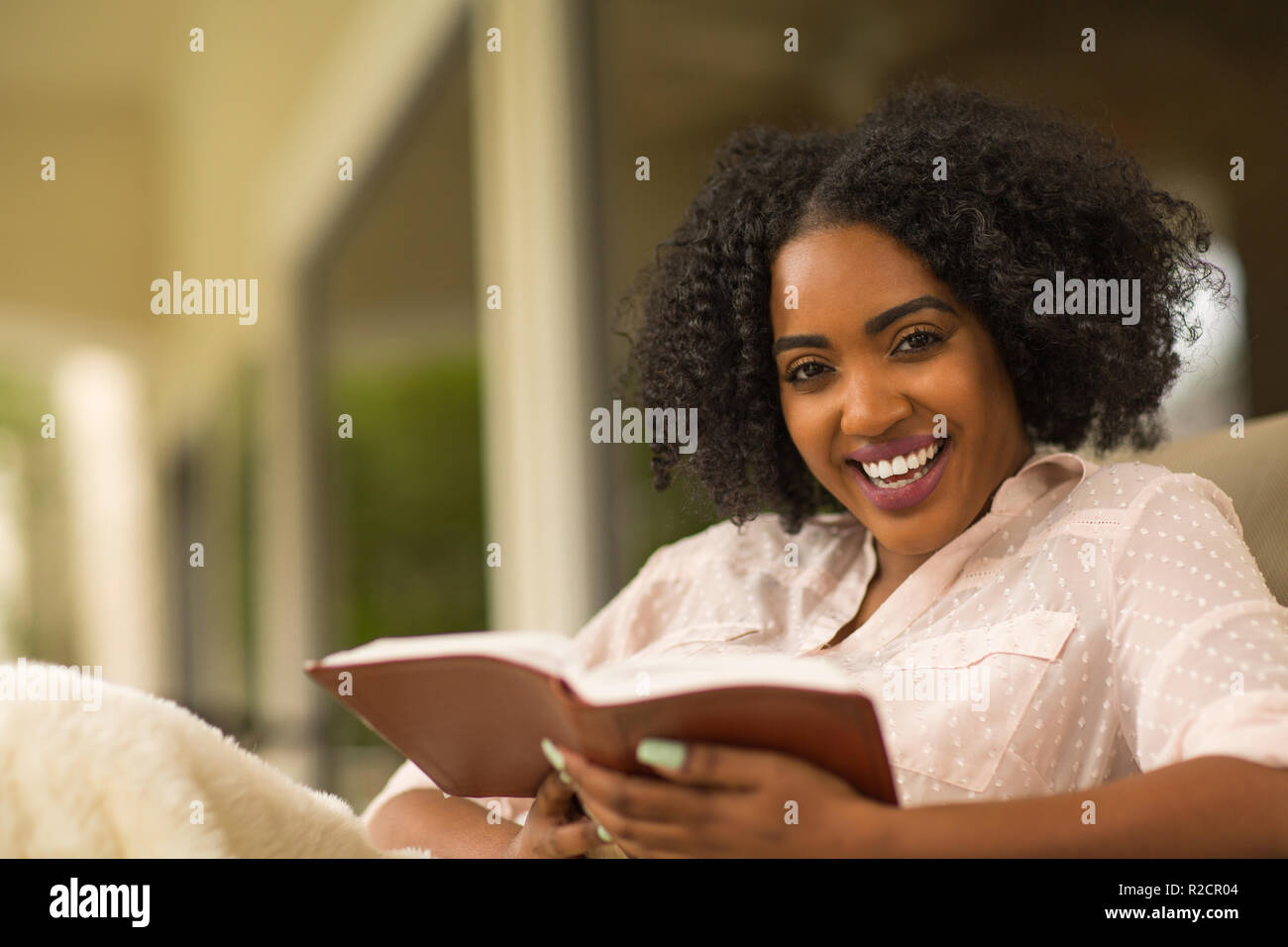 African american woman reading bible hi-res stock photography and ...
