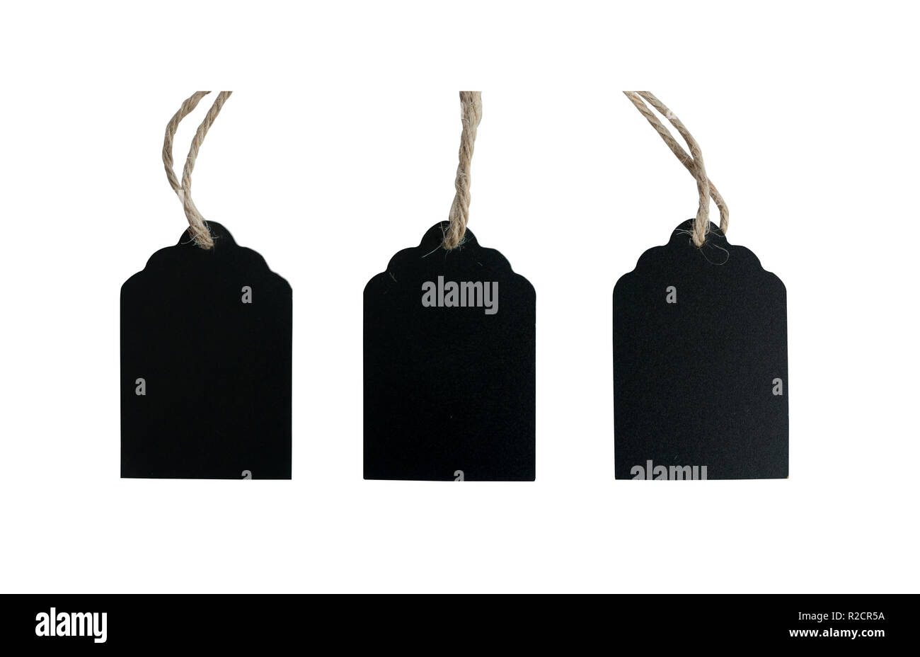 Three blank black wooden tag and brown rope isolated on white ...