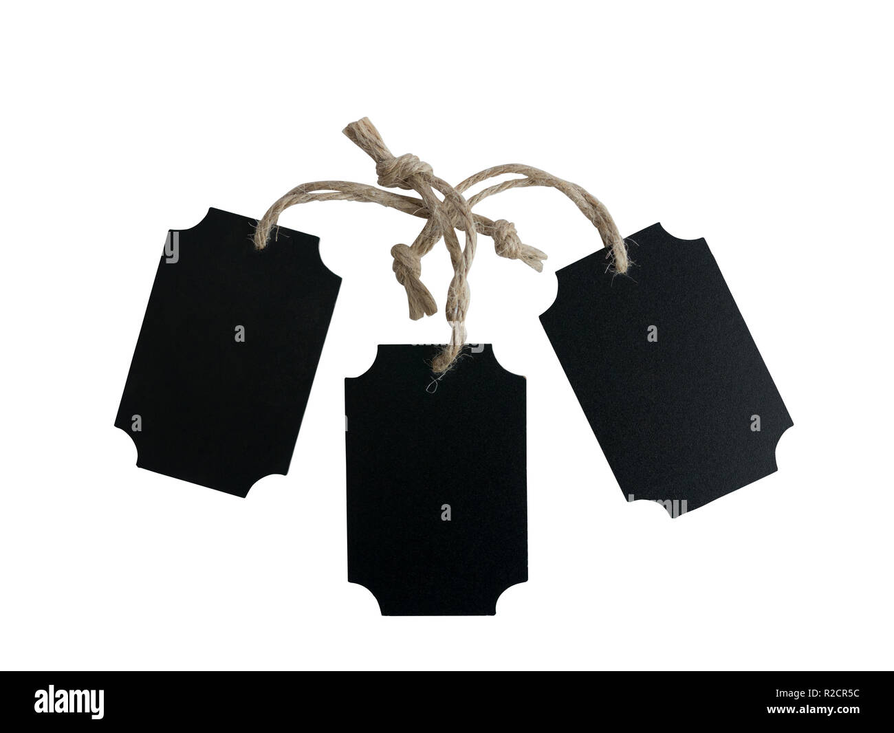 Three blank black wooden tag tied with brown rope isolated on white ...