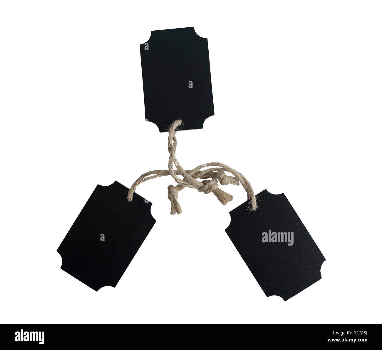 Three blank black wooden tag tied with brown rope isolated on white ...