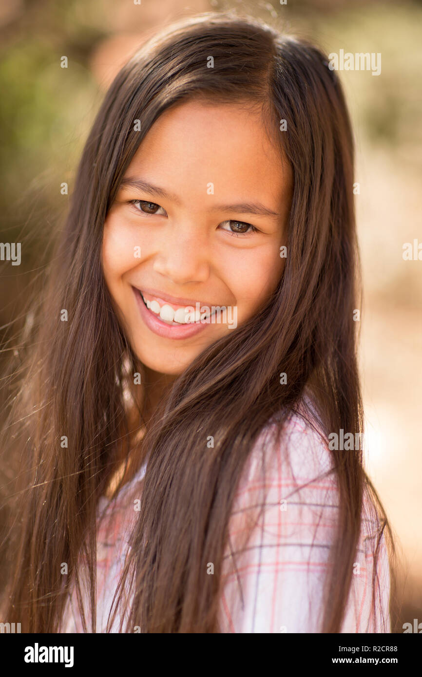 Portrait of a young asian girl smiling outside Stock Photo - Alamy