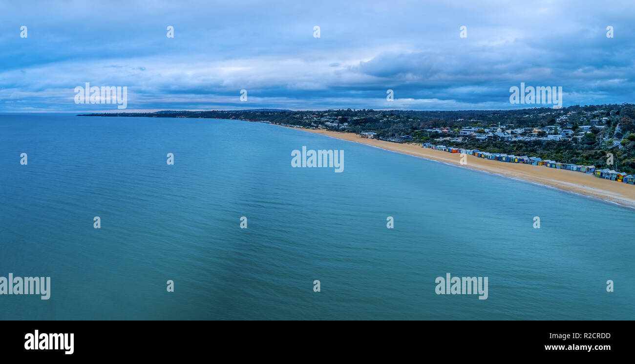 Wide aerial panorama of Mount Martha beach with bathing huts at sunset ...