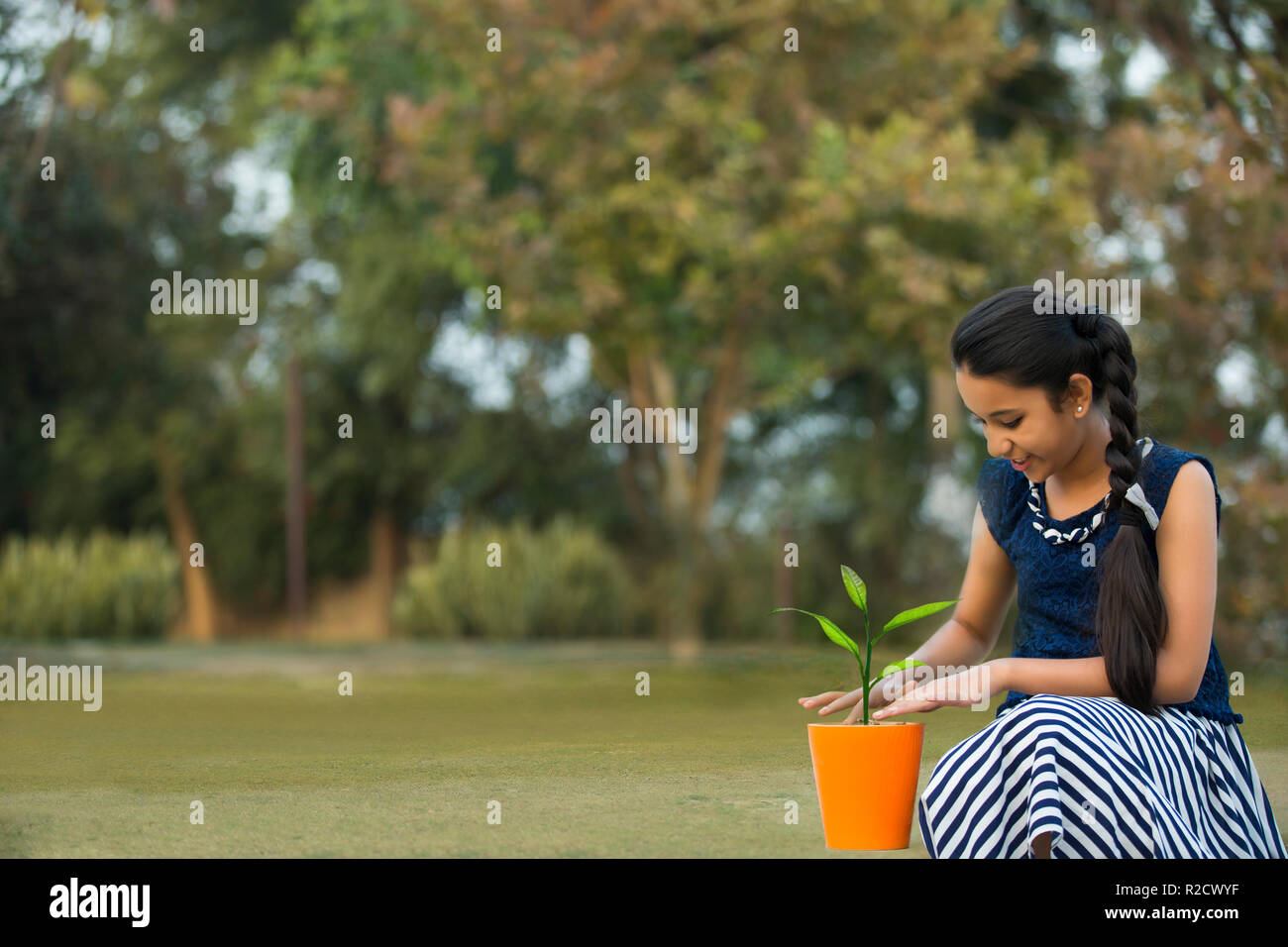 Girl Planting Sapling High Resolution Stock Photography and Images - Alamy