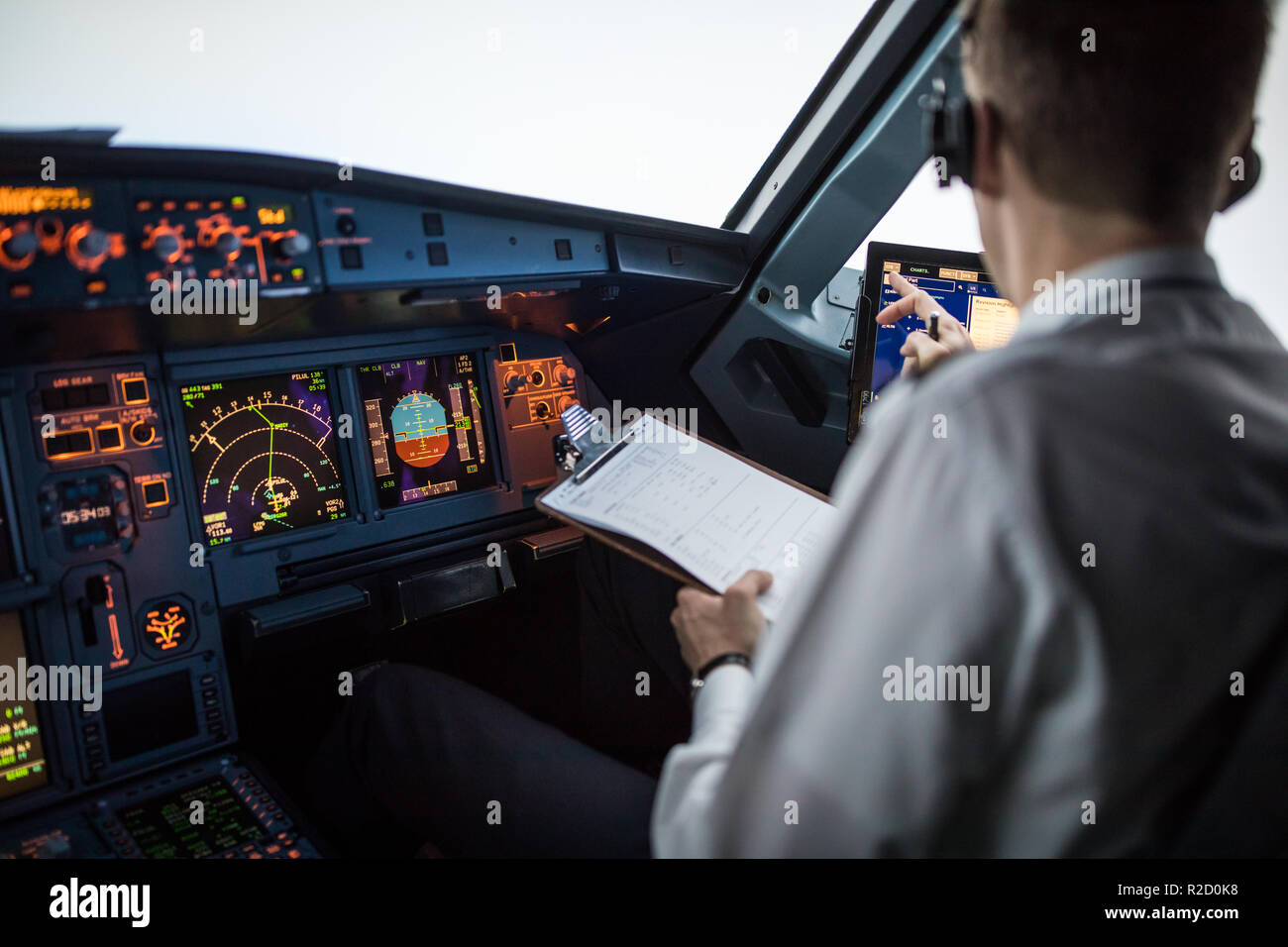 Pilot's hand accelerating on the throttle in a commercial airliner ...
