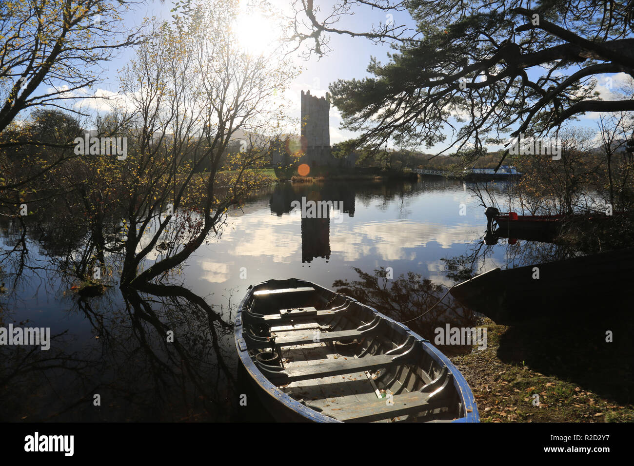 lake side castle reflected in lower lake, killarney, county kerry ...
