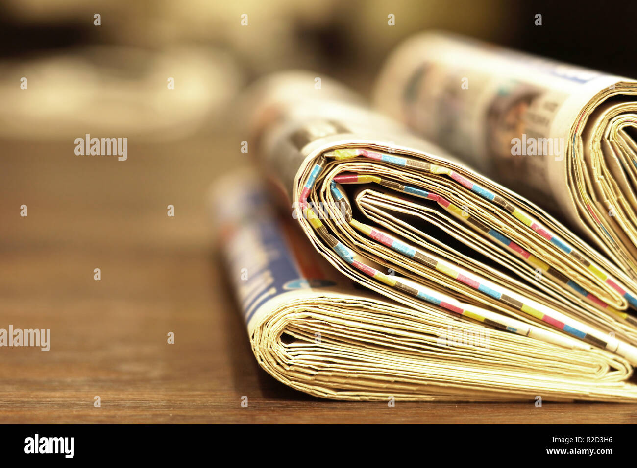 Newspaper background.Texture of folded and rolled old yellow pages with ...