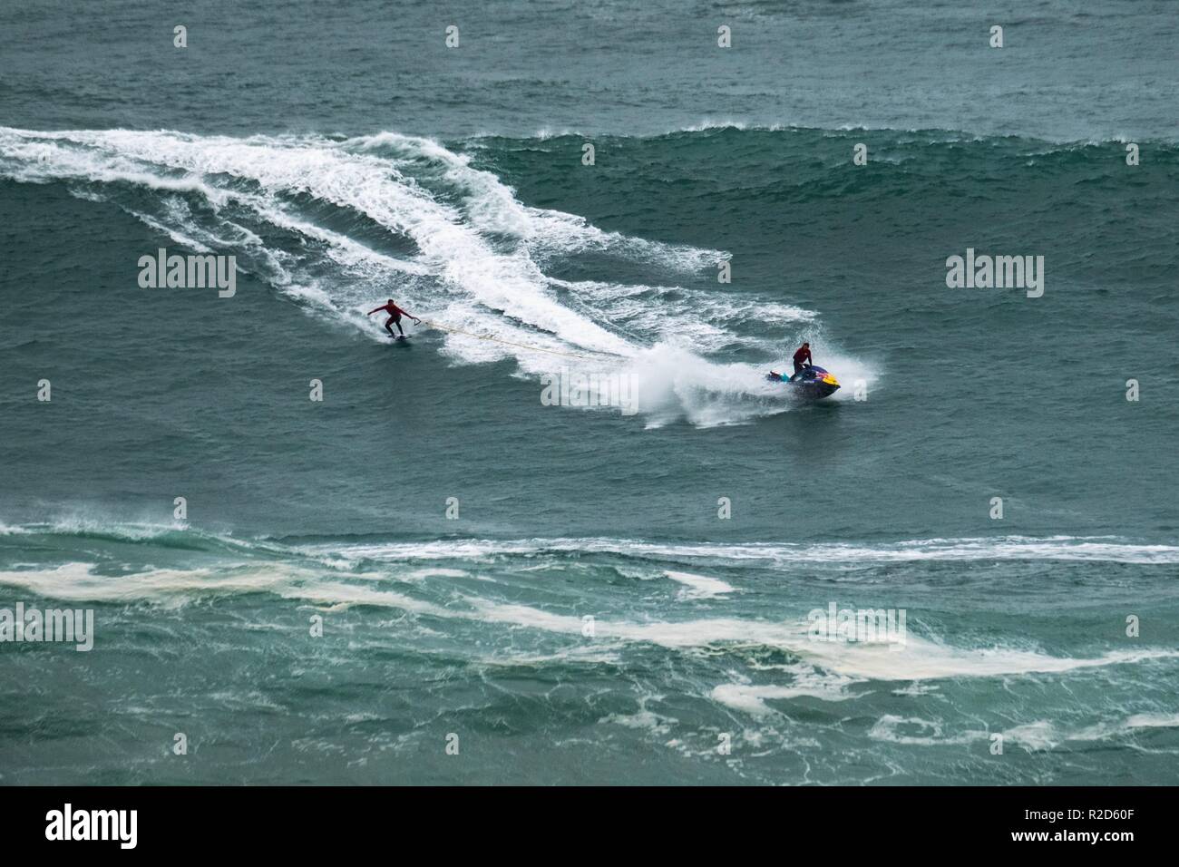 Nazare, Portugal. 18th Nov, 2018. Surfers tow in to giant waves at ...