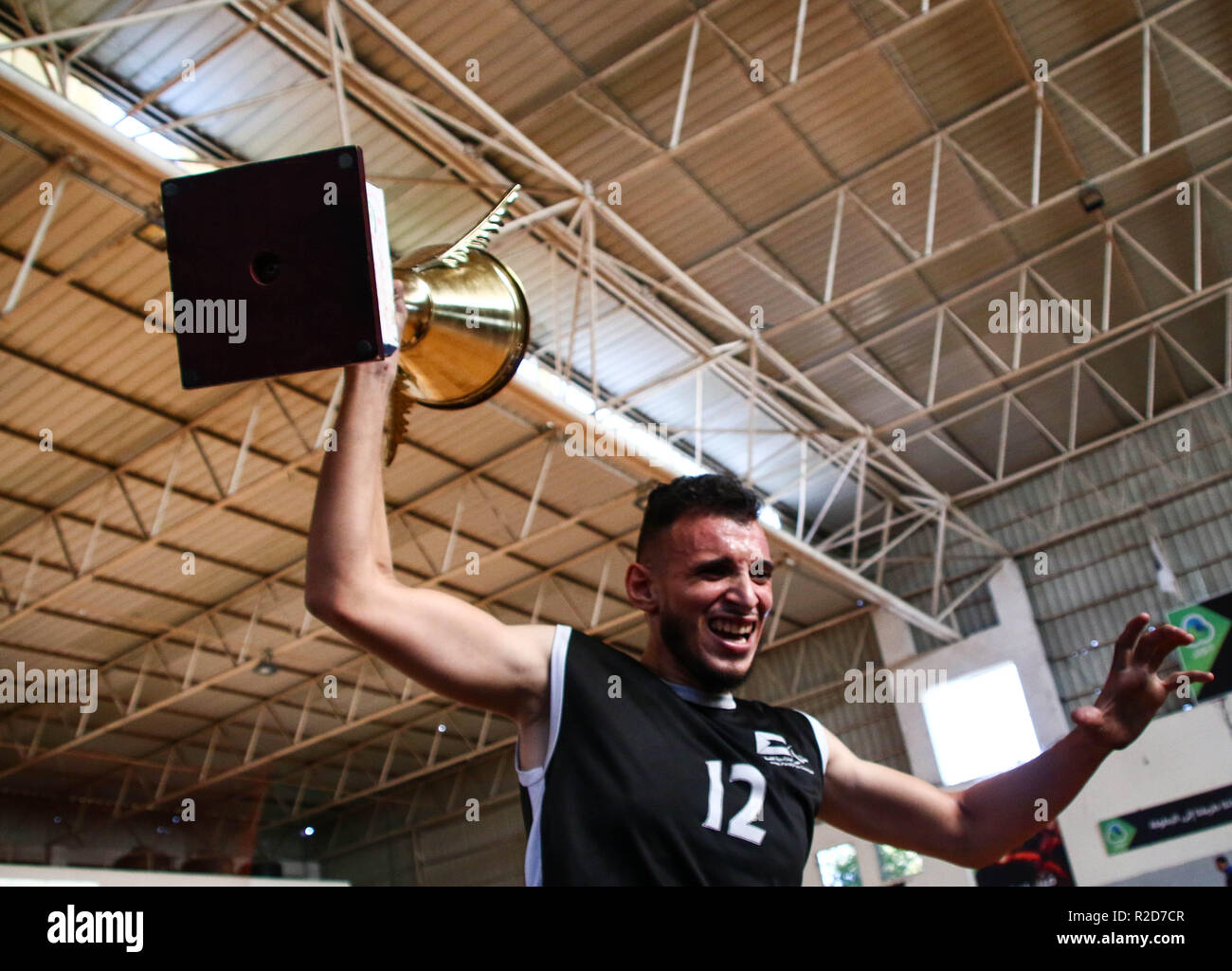 Al Salam Sports Club player seen holding a trophy as he celebrates ...