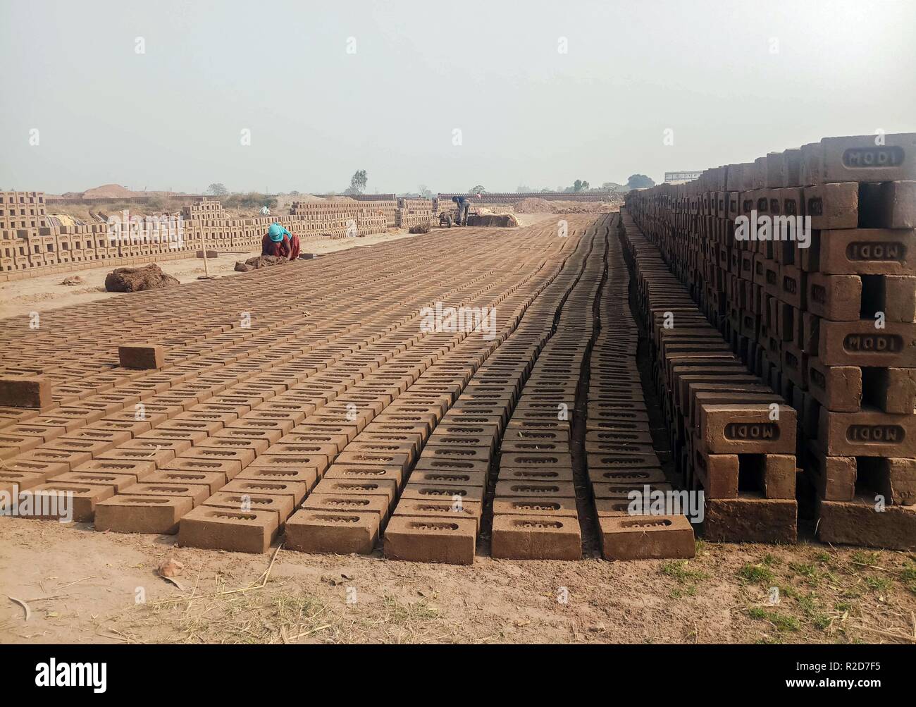 A woman labourer seen making bricks at a brick kiln factory in ...