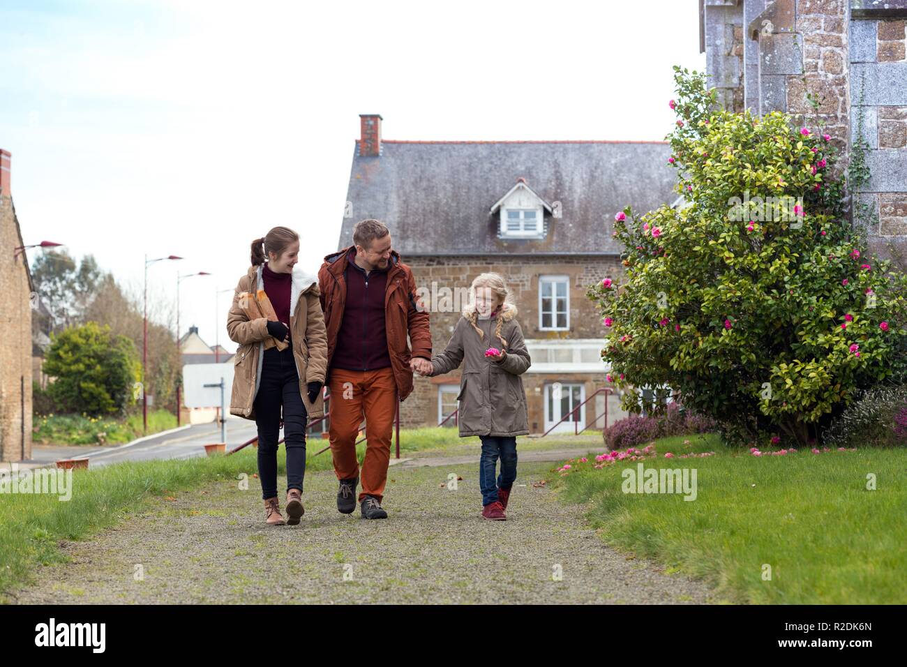happy dad and two daughters stroll around the old city, france Stock ...