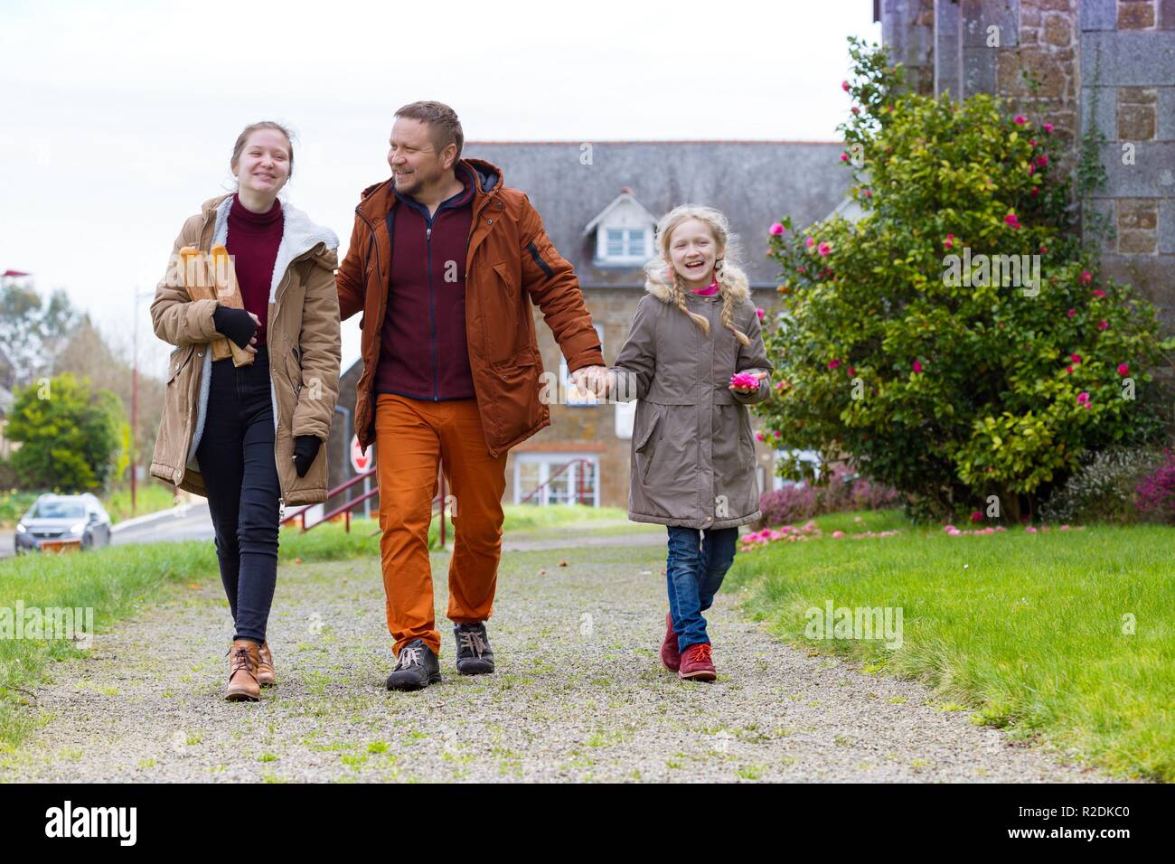 happy dad and two daughters stroll around the old city, france Stock ...