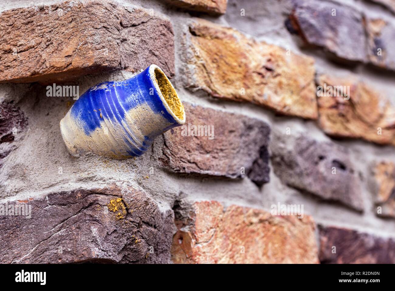 brick wall with decor elements in the form of a pot of clay Stock Photo ...