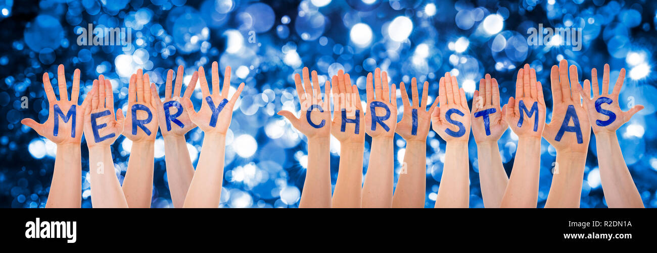 Hands Building Word Merry Christmas, Glittering And Sparkling Bokeh ...
