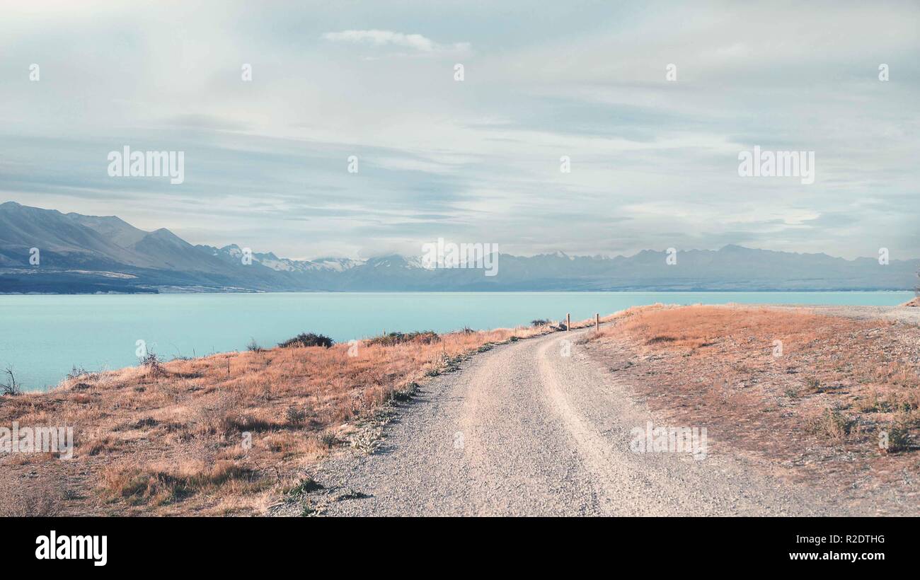 Path, lake and mountains Stock Photo - Alamy