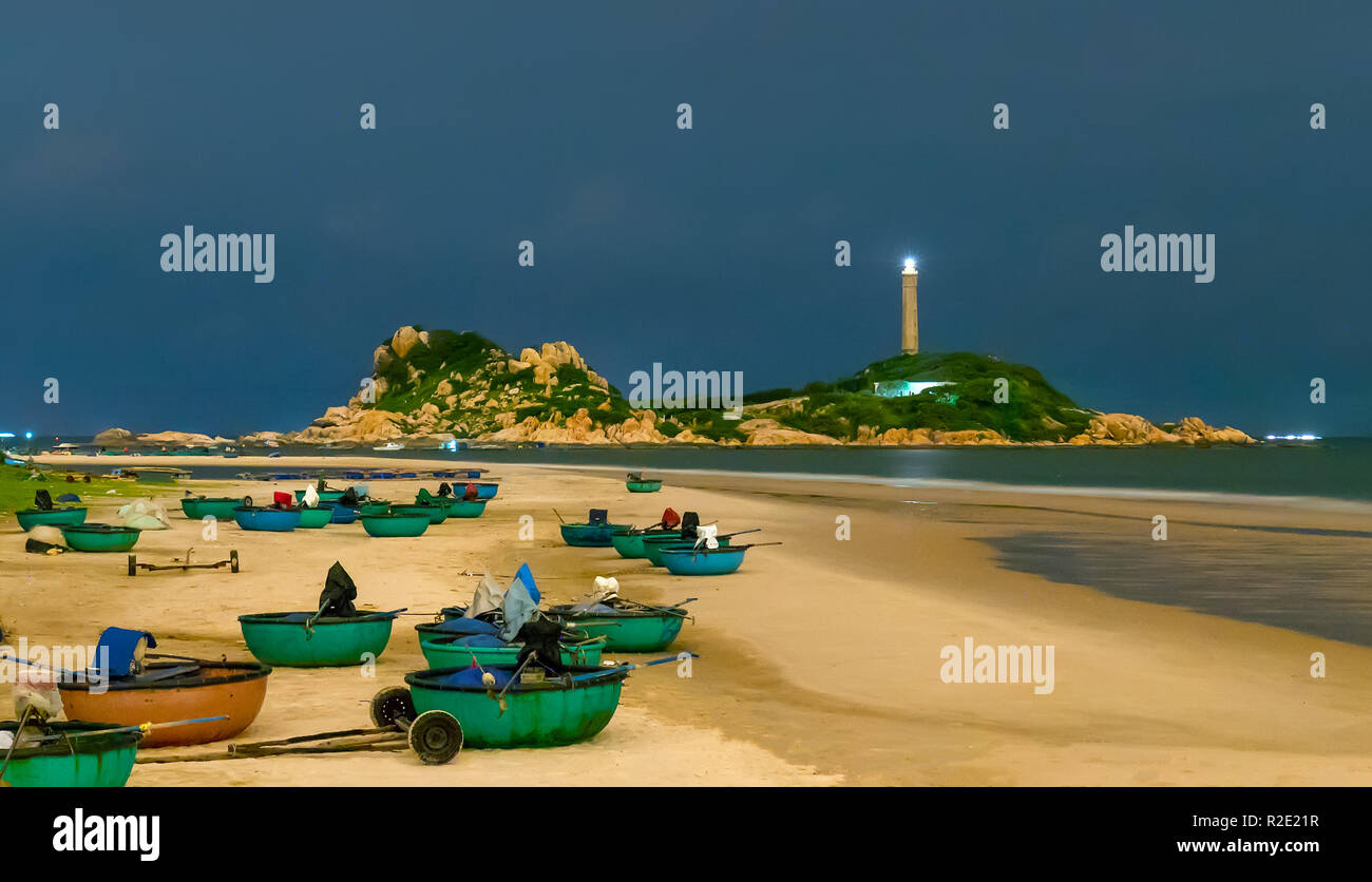 Lighthouse shines at night on the beautifully located island. This is a ...