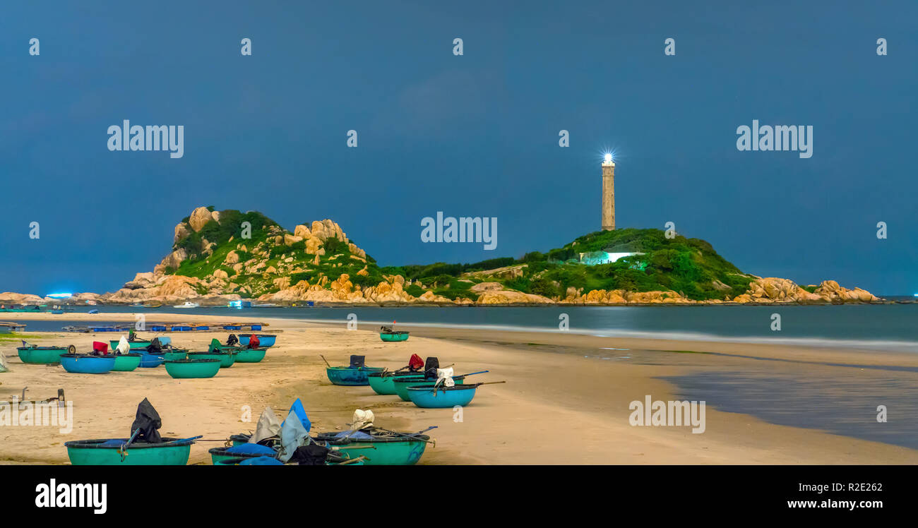 Lighthouse shines at night on the beautifully located island. This is a ...