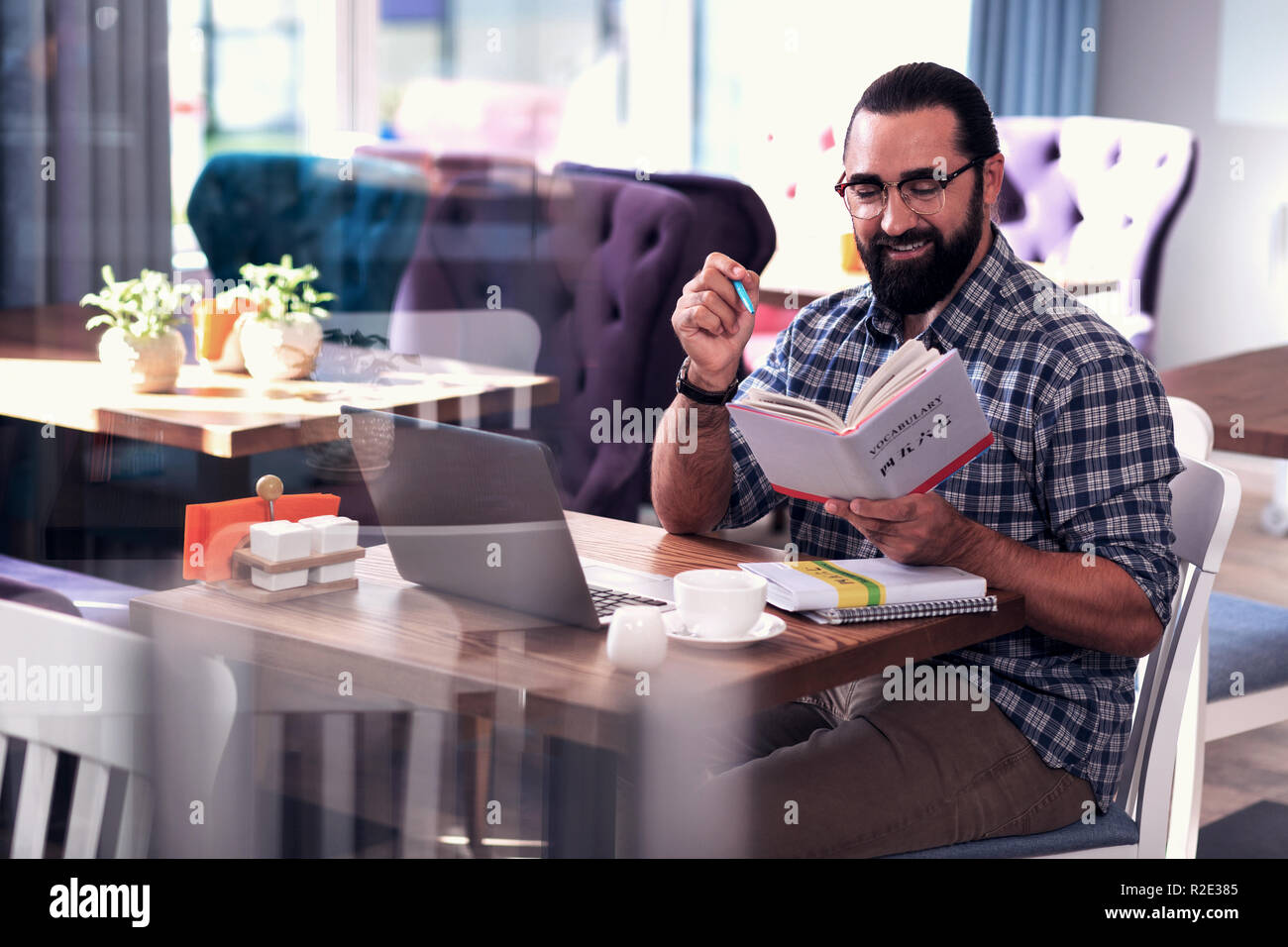 Businessman feeling involved in studying foreign vocabulary Stock Photo ...