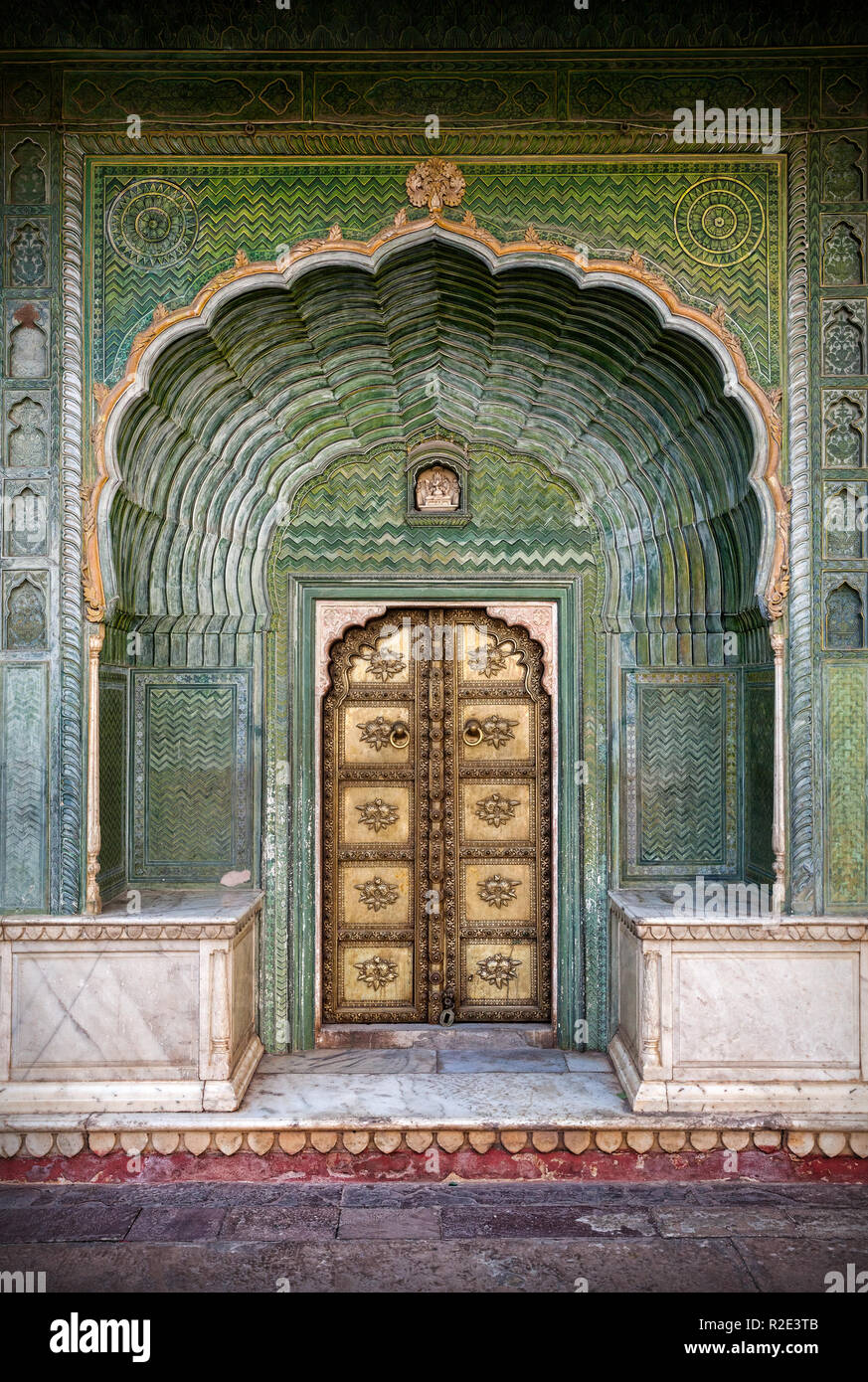 Green gate and golden door in City Palace of Jaipur, Rajasthan, India ...