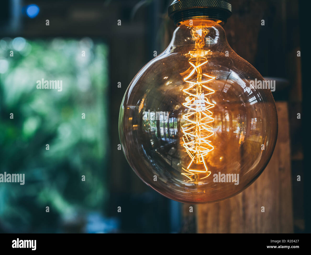 Decorative antique edison vintage style light bulb on cafe background ...