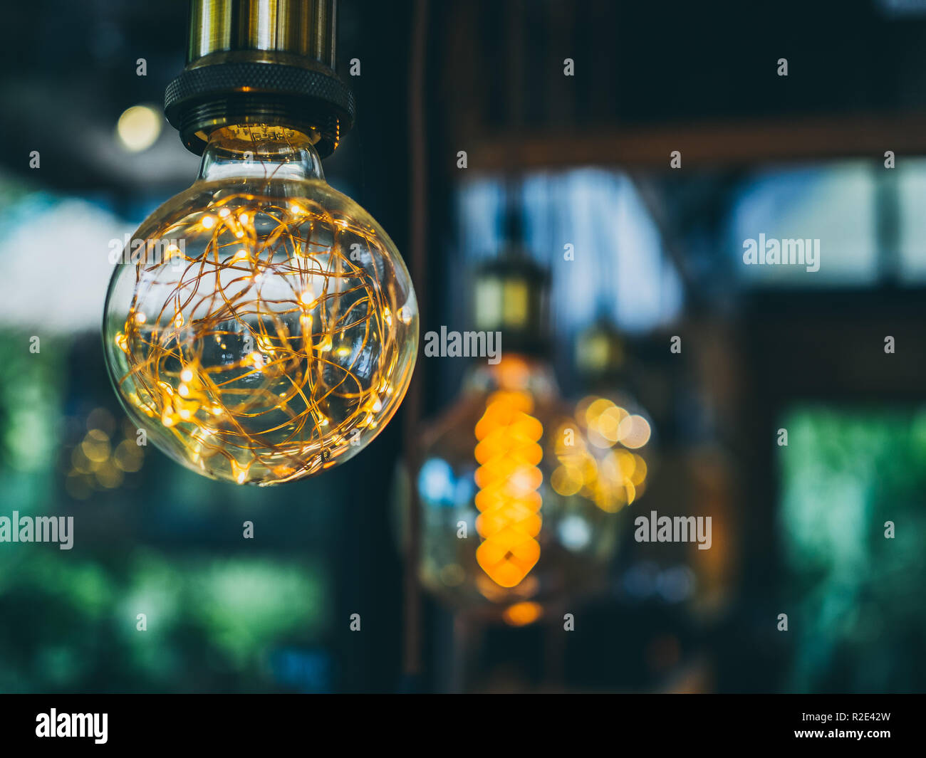 Decorative antique edison vintage style light bulbs on cafe background ...