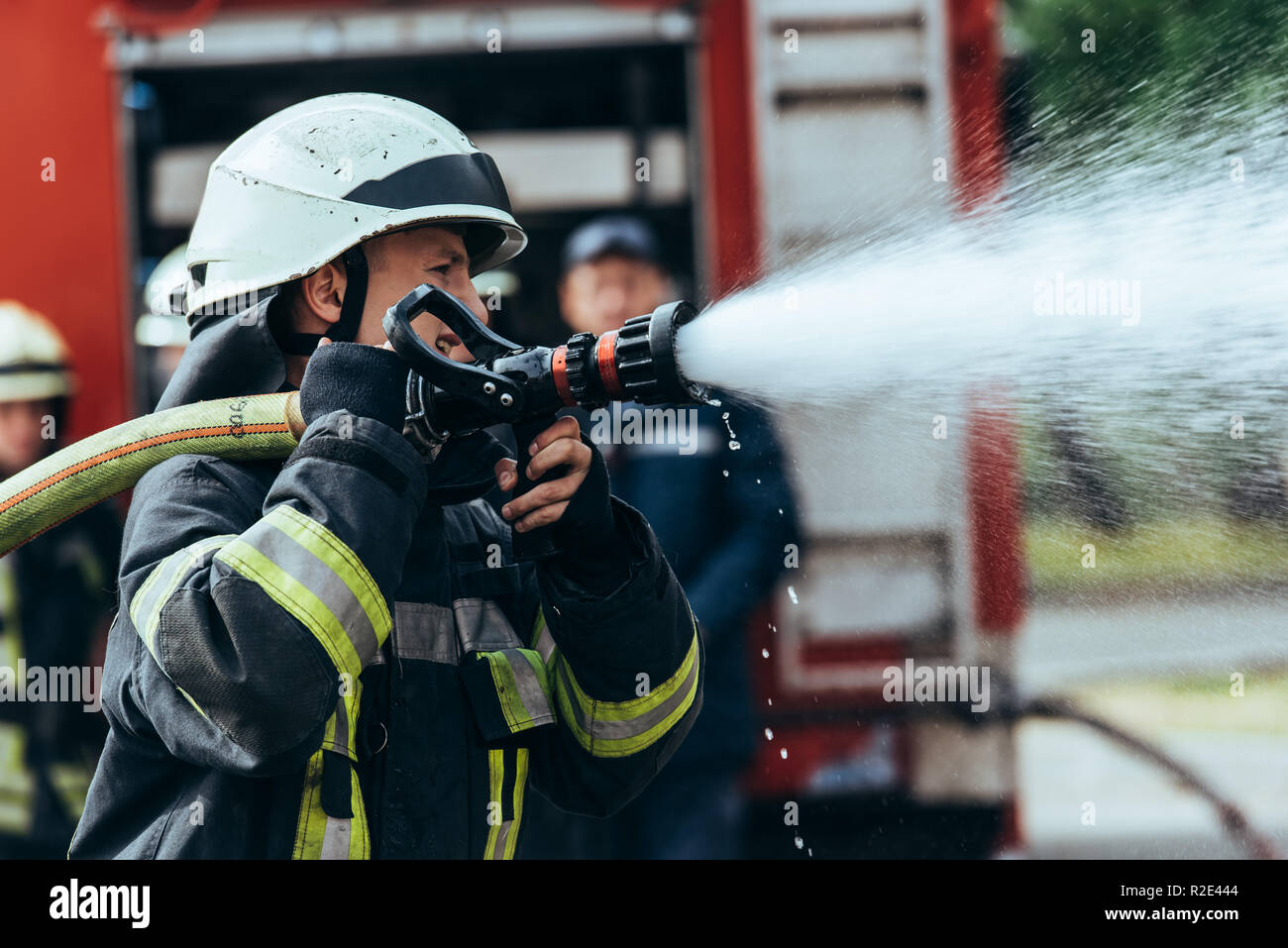 Firefighting hose team hi-res stock photography and images - Alamy