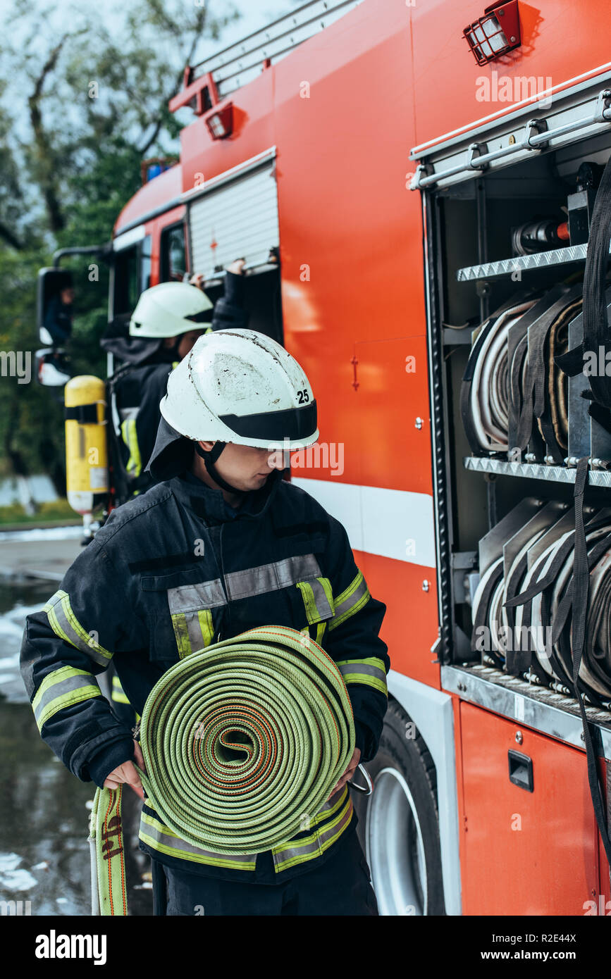 Firefighter emergency service hoses hi-res stock photography and images ...