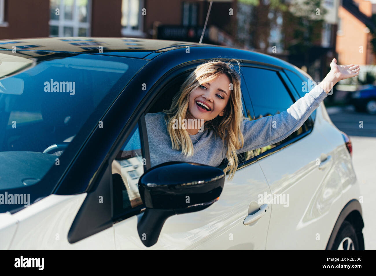 Waving to car driving hi-res stock photography and images - Alamy