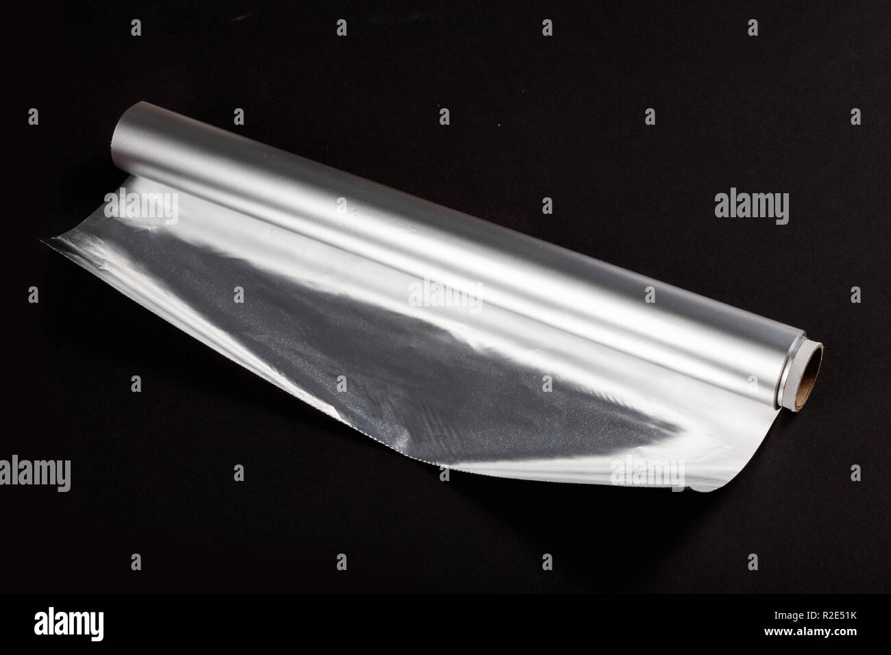 Aluminum foil roll on the black background, close up Stock Photo - Alamy