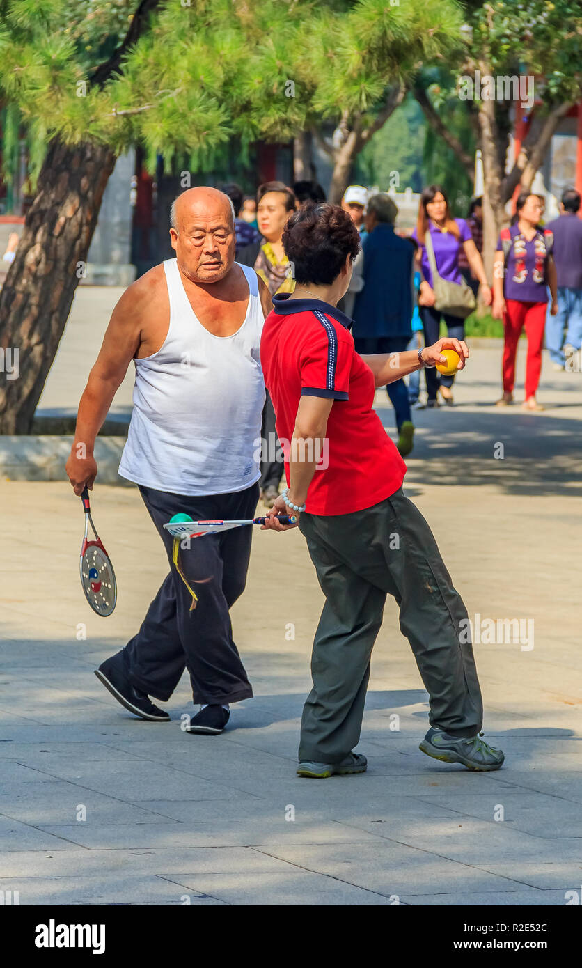 Beijing, China - September 20, 2013: Elder couple playing Chinese game ...