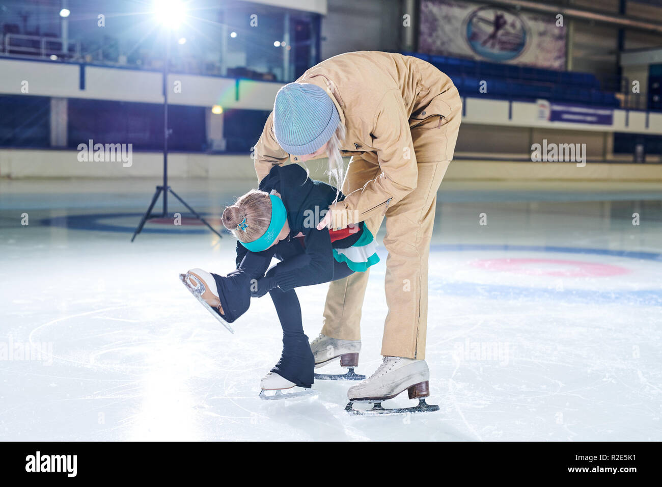 Girl Learning Ice Skating Stunts Stock Photo - Alamy