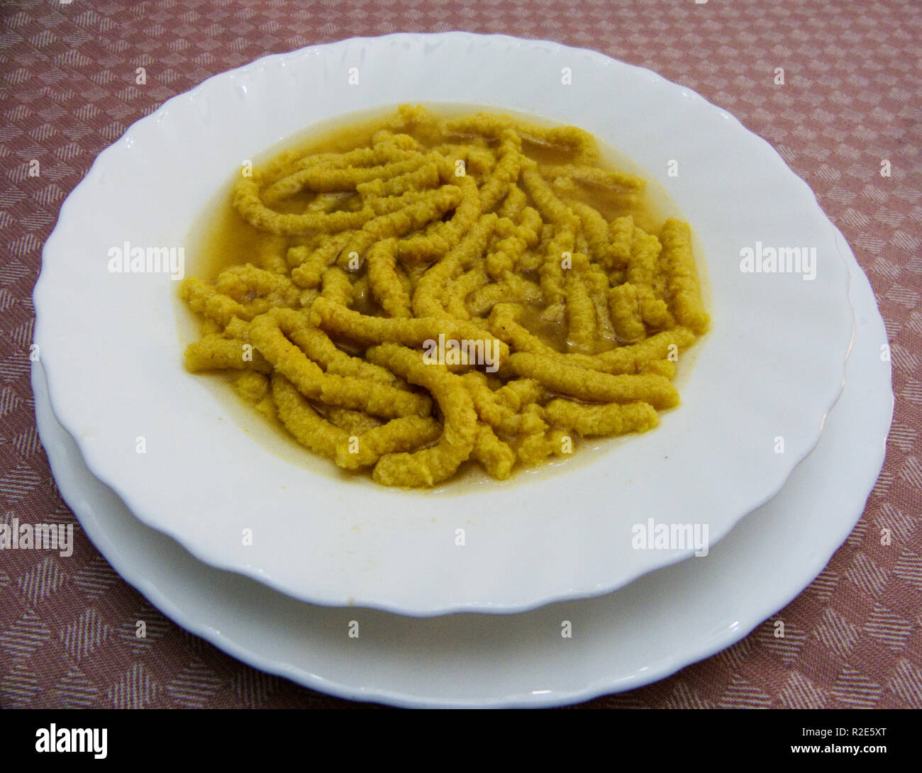 Passatelli in brodo Stock Photo - Alamy