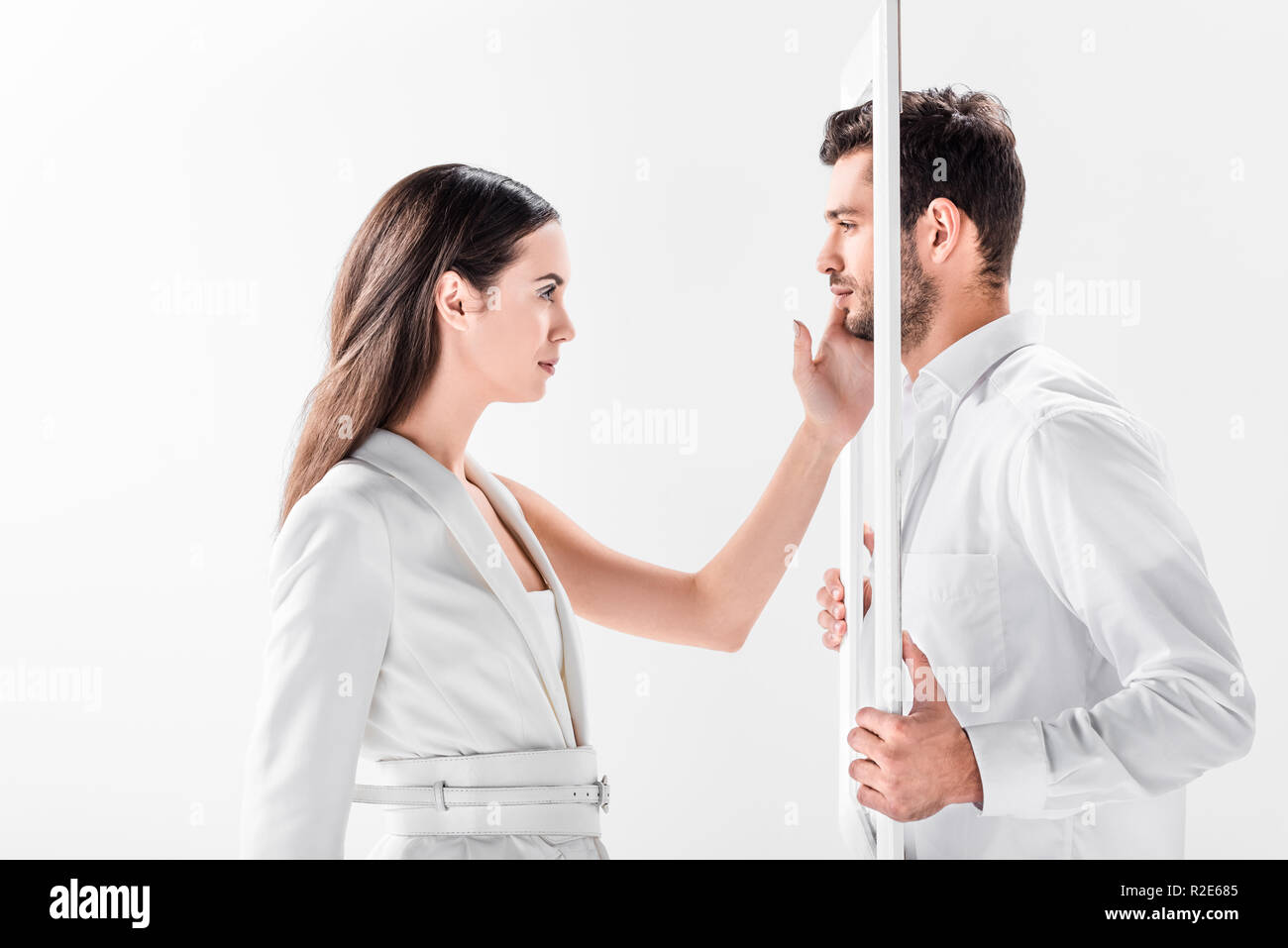 beautiful woman touching man with frame isolated on white Stock Photo ...