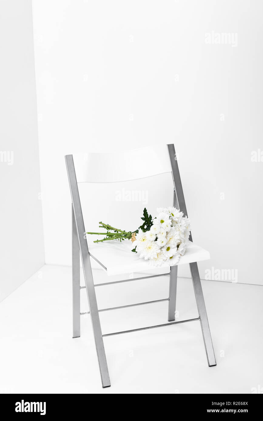 Flowers on chair hi-res stock photography and images - Alamy