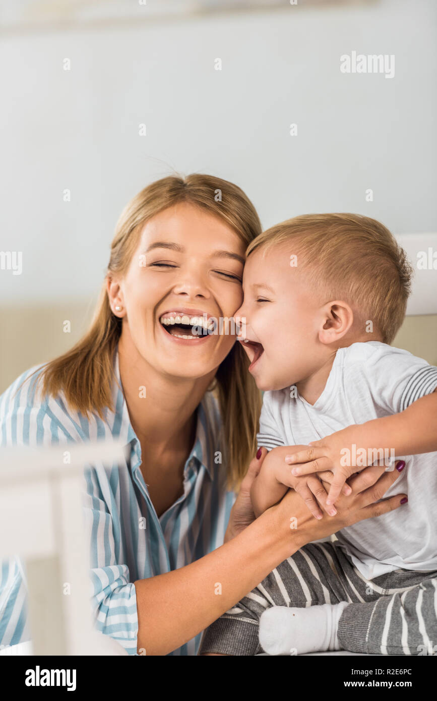 happy mother having great time with cheerful son Stock Photo - Alamy
