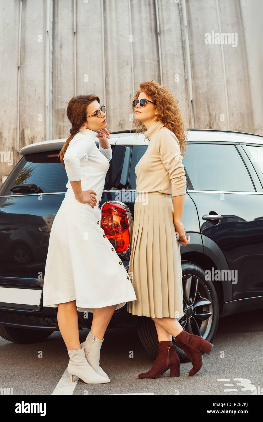 Female models posing with car hi-res stock photography and images - Alamy