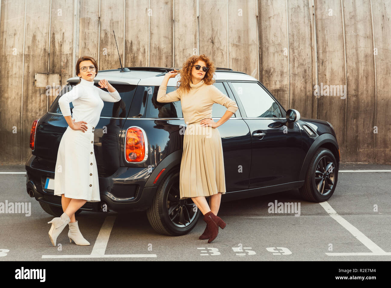 Female models posing with car hi-res stock photography and images - Alamy