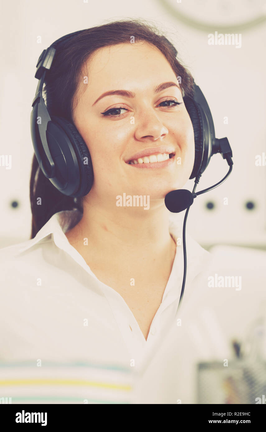Young female worker productively operating at call-center Stock Photo - Alamy